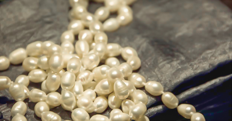 What Do Pearls Symbolize in a Woman?